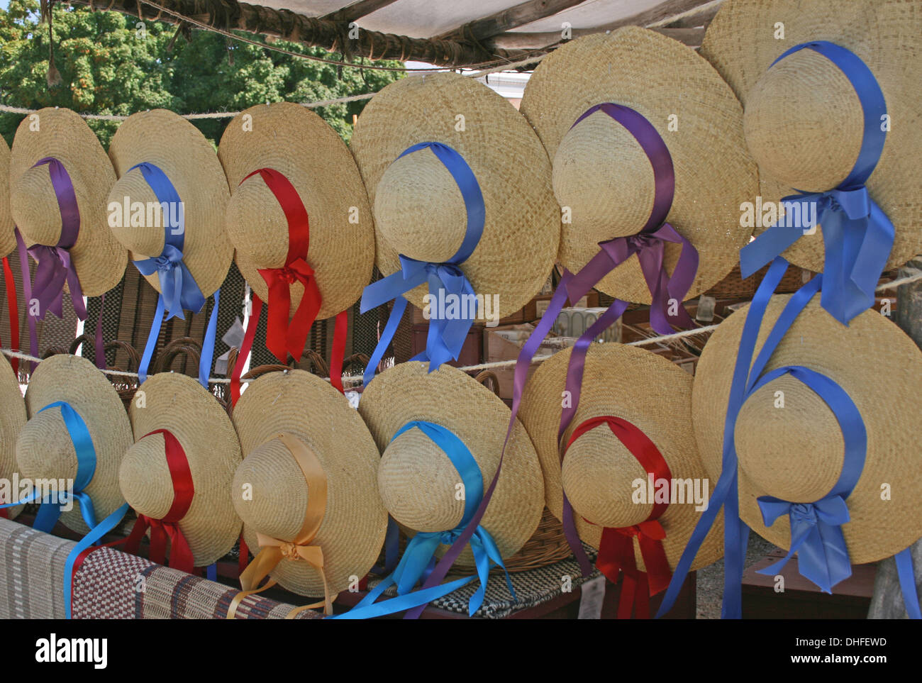 Girls beribboned straw sun hats hanging on a clothesline Stock Photo ...