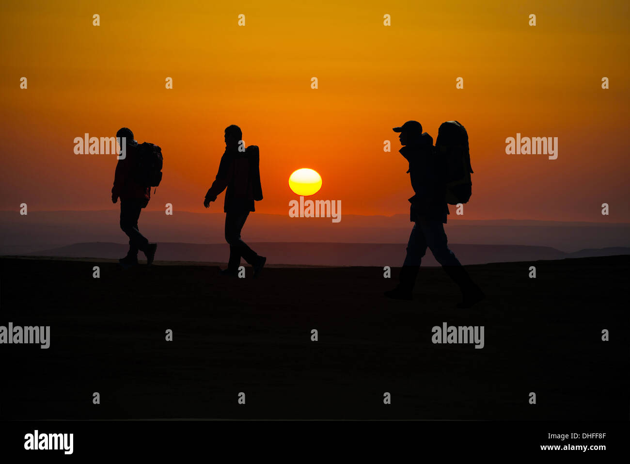 The three hikers walk trip, in the top of the sunrise Stock Photo - Alamy