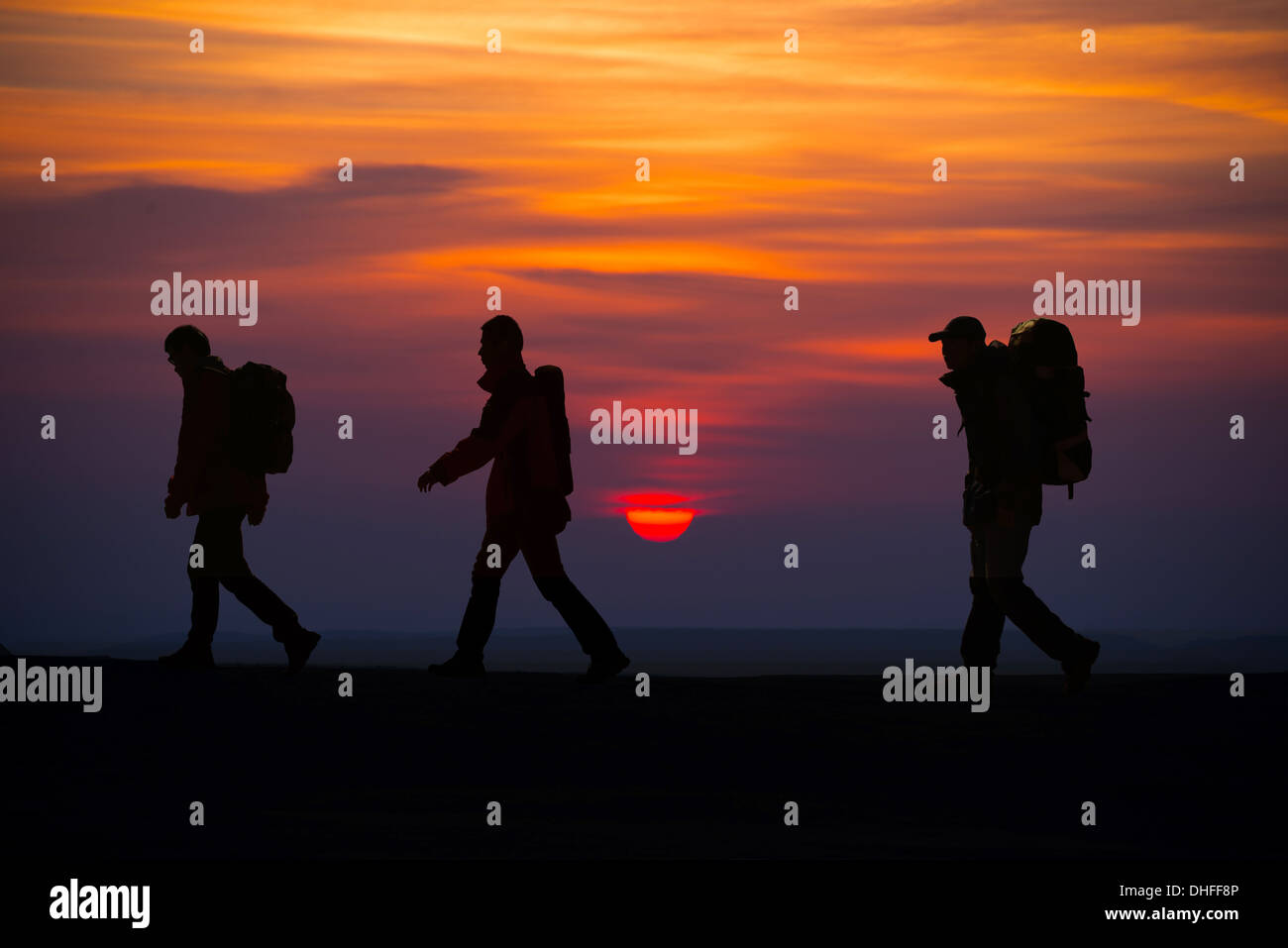 The three hikers walk trip, in the top of the sunrise Stock Photo - Alamy