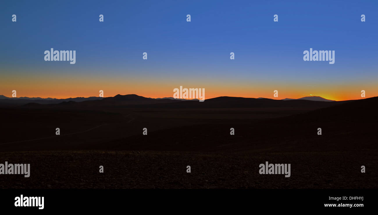 Sunset in the Atacama Desert. Silhouette of the mountains as the sun ...
