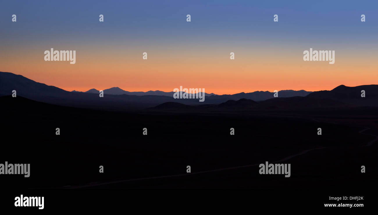 Sunset in the Atacama Desert. Silhouette of the mountains as the sun ...