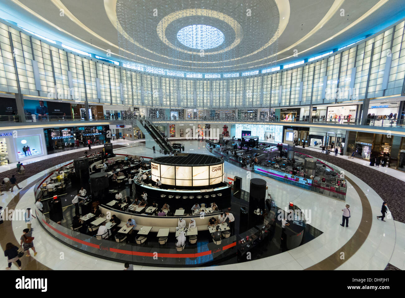Interior of large atrium with cafes and shops at Dubai Mall in Dubai ...