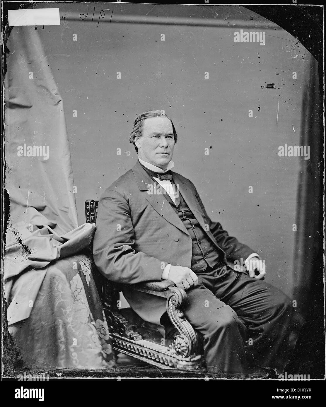 A formal portrait of a gentleman, dressed in a suit, epitomizing ...