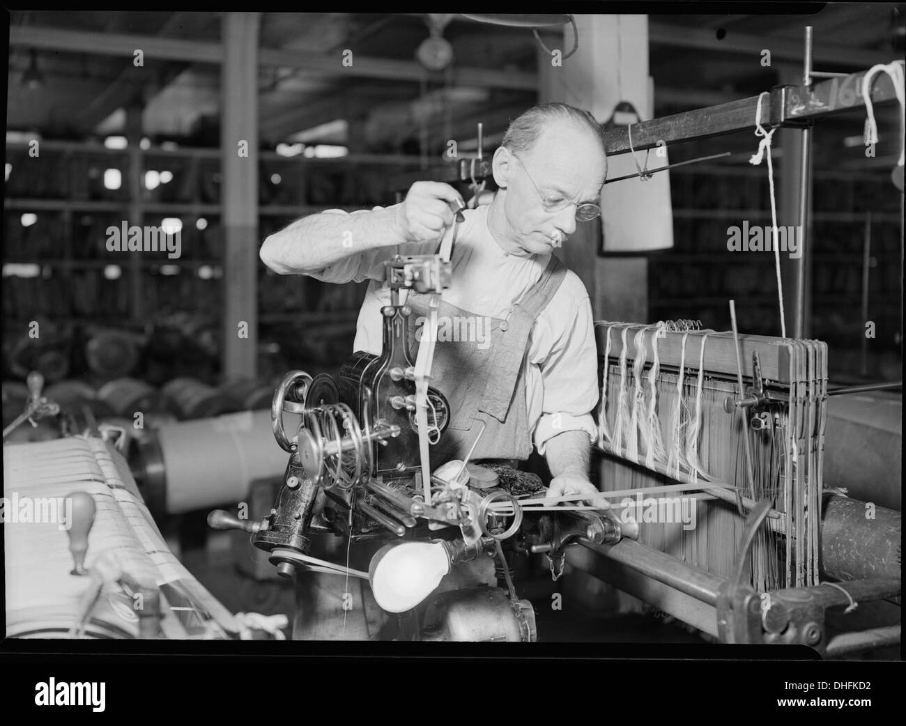 This close-up photograph shows workers at William Skinner and Sons Silk ...