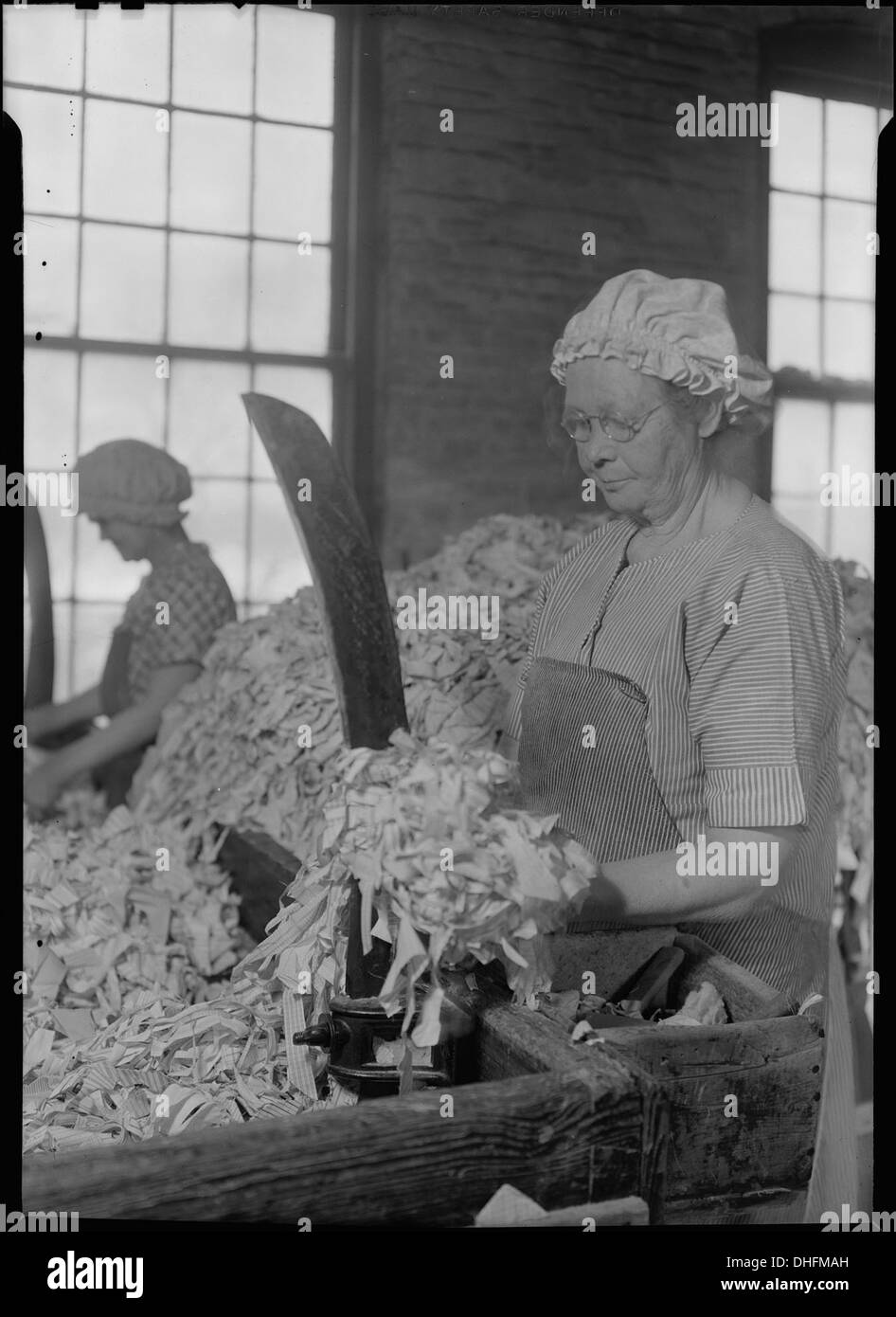 This historical photograph shows rag sorting at the American Writing ...