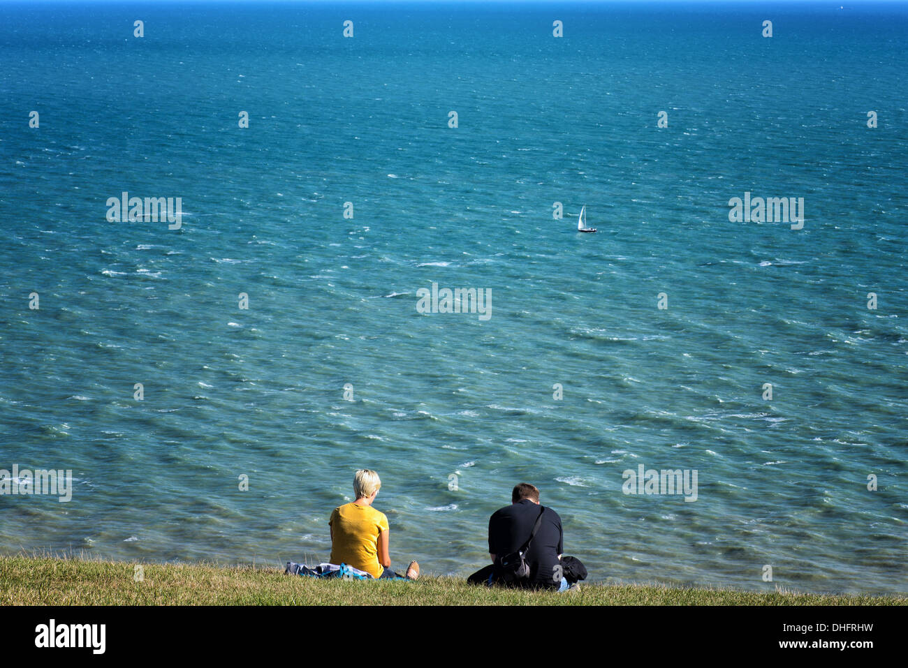 Couple watching sail boat hi-res stock photography and images - Alamy