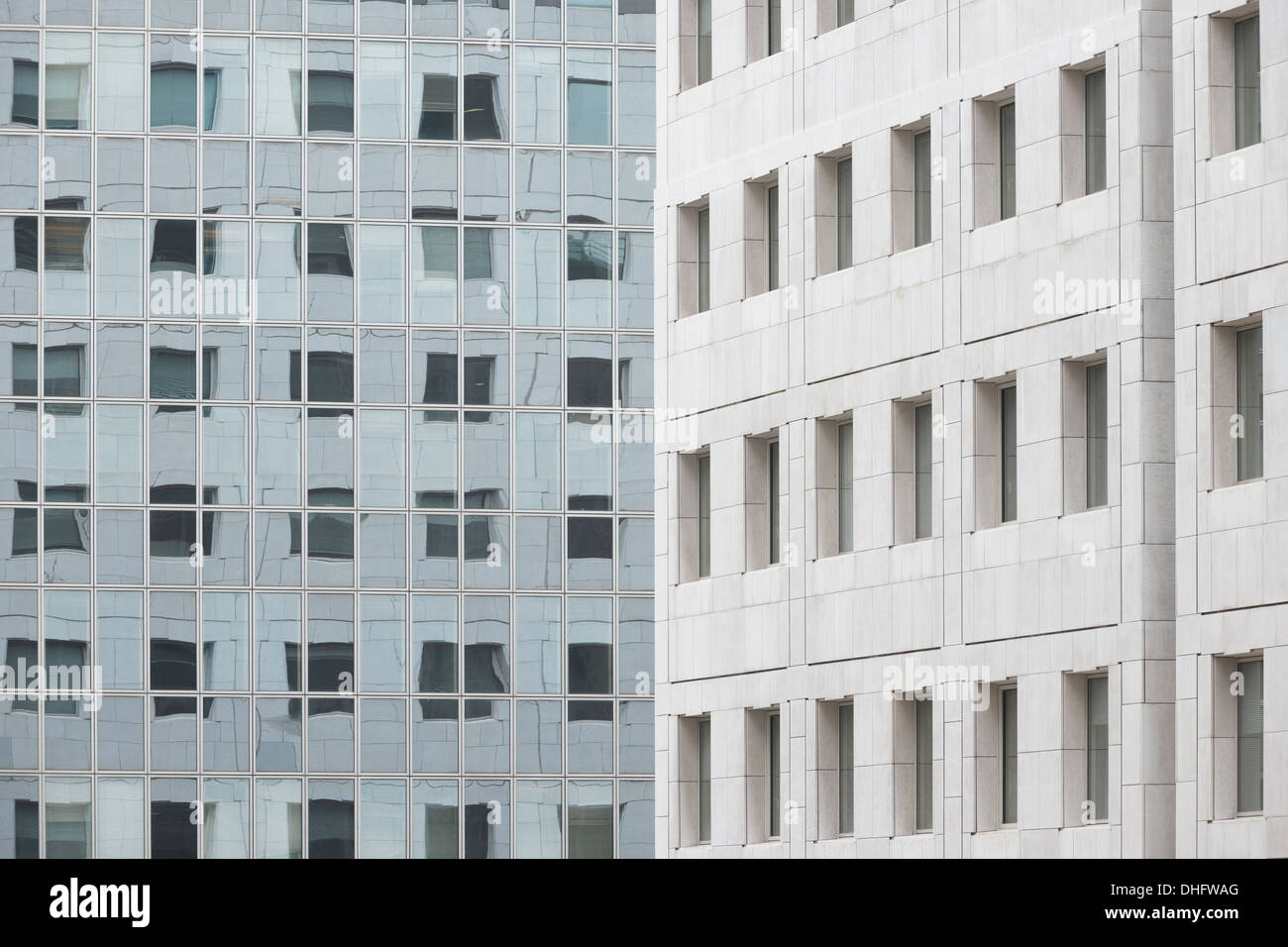 A skyscraper's reflection distorted by the windows of a neighbouring ...