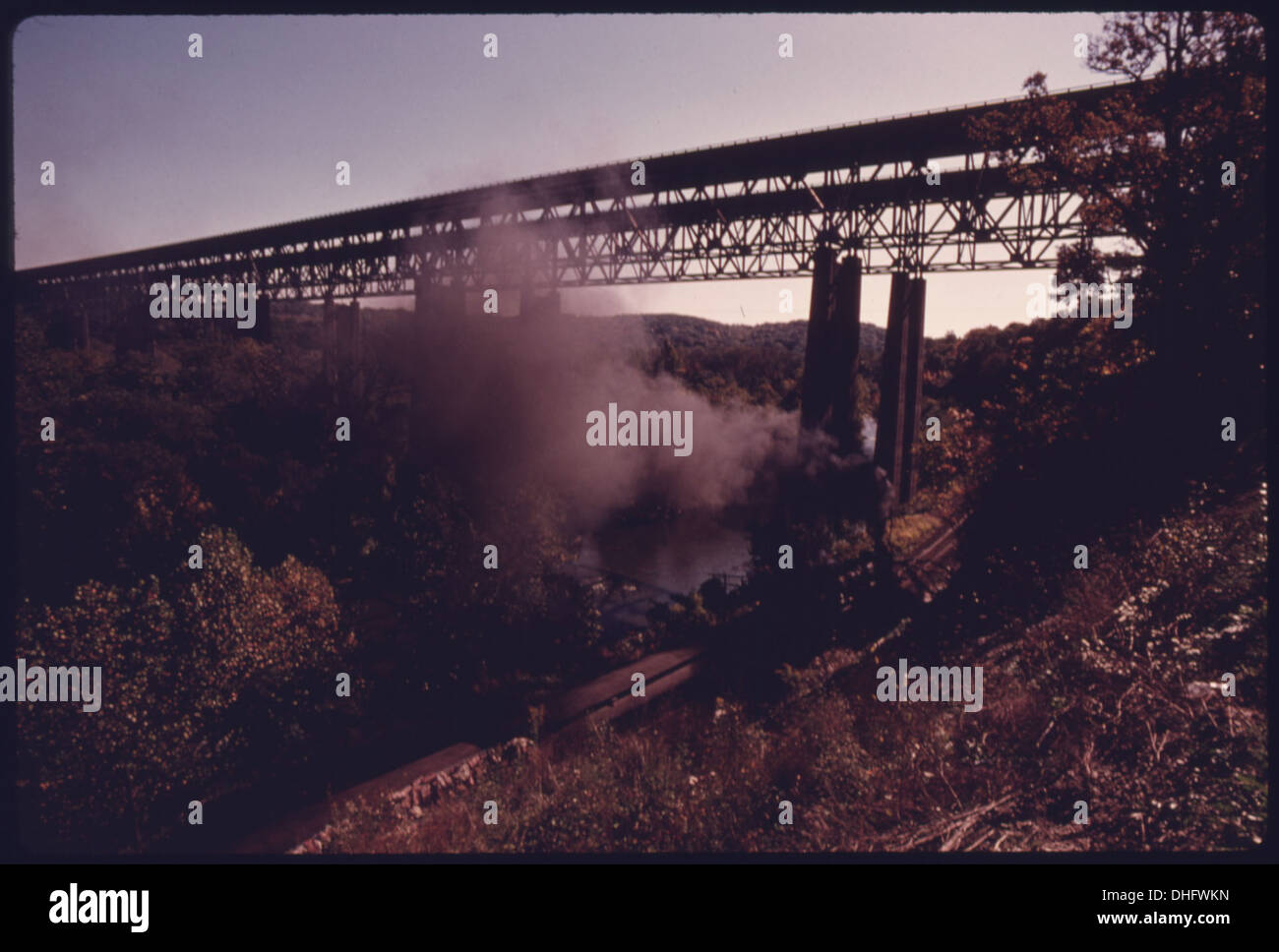 A steam-powered train from the Cuyahoga Valley Line passes beneath the ...