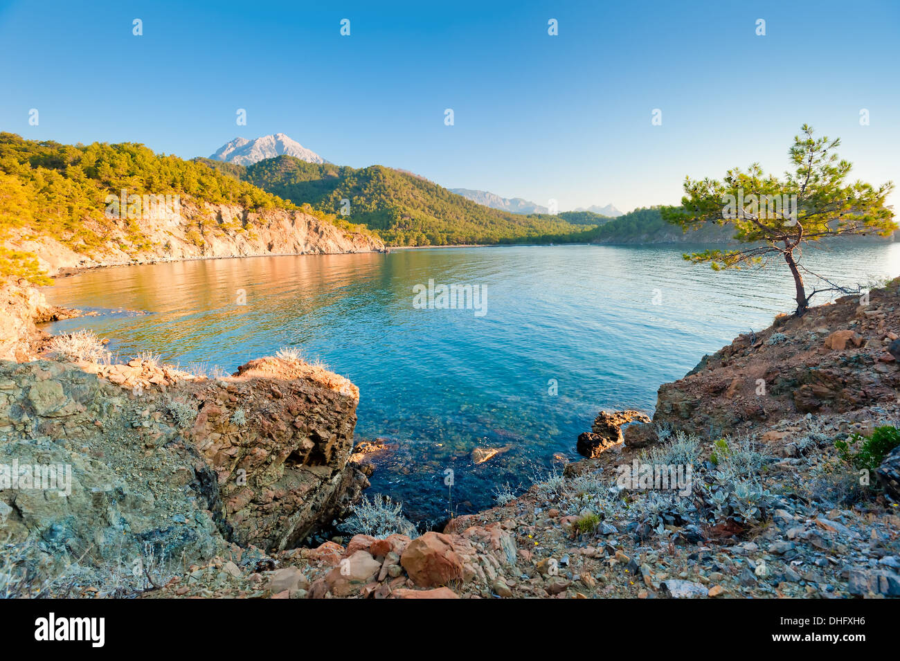 a beautiful bay with clear water and mountains Stock Photo - Alamy