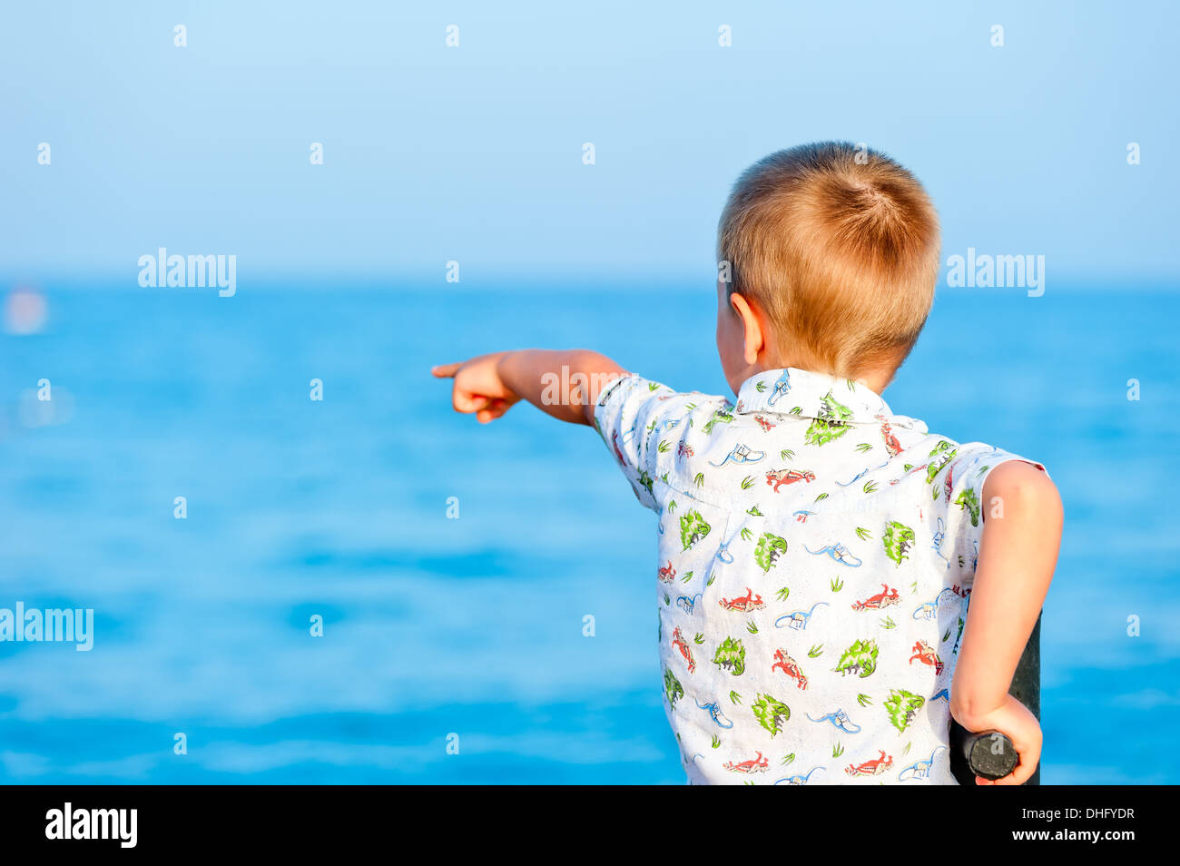 child points to something in the sea Stock Photo - Alamy