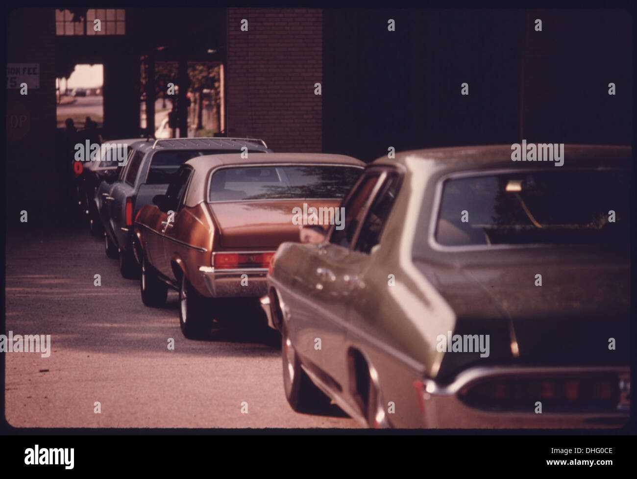 Motorists wait in line at an auto emission inspection station in ...