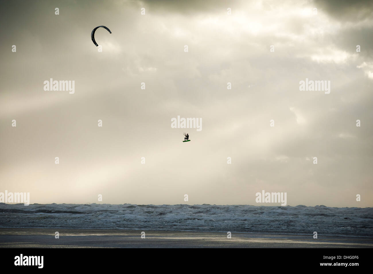 Kite surfer flying through the air Stock Photo - Alamy