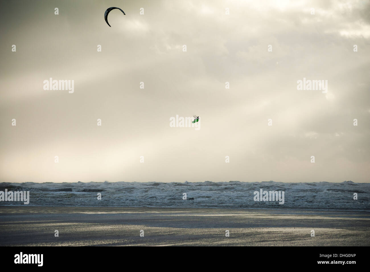 Kite surfer flying through the air Stock Photo - Alamy