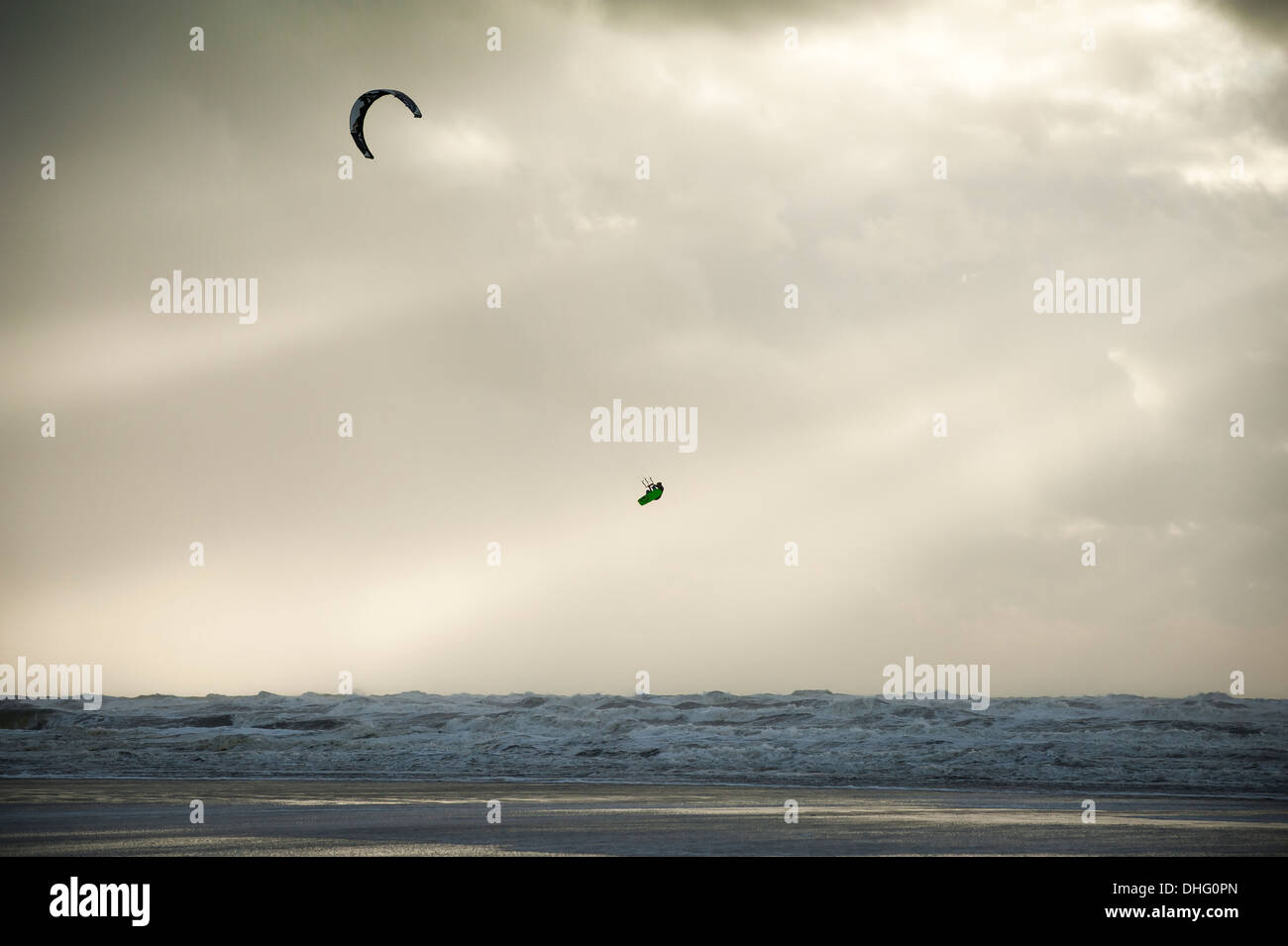 Kite surfer flying through the air Stock Photo - Alamy