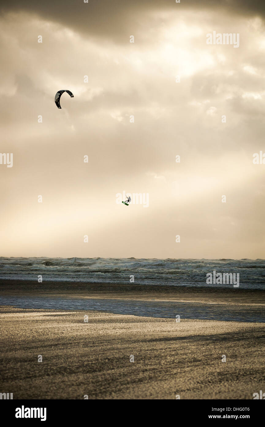 Kite surfer flying through the air Stock Photo - Alamy