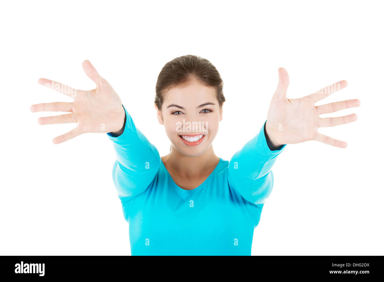 Attractive young woman with hands open in front on her. Isolated on ...