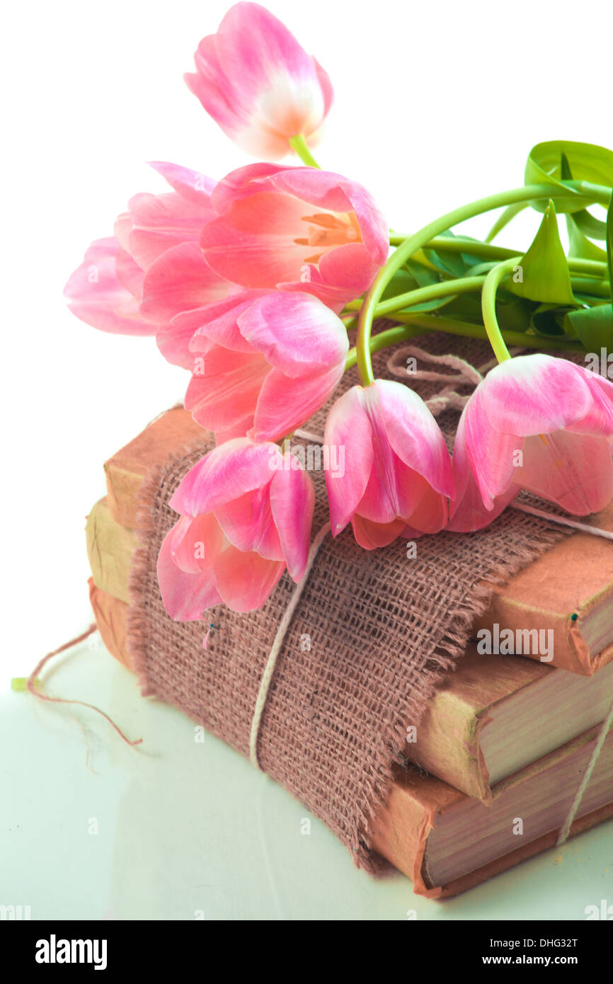 Pink tulips on old books Stock Photo - Alamy