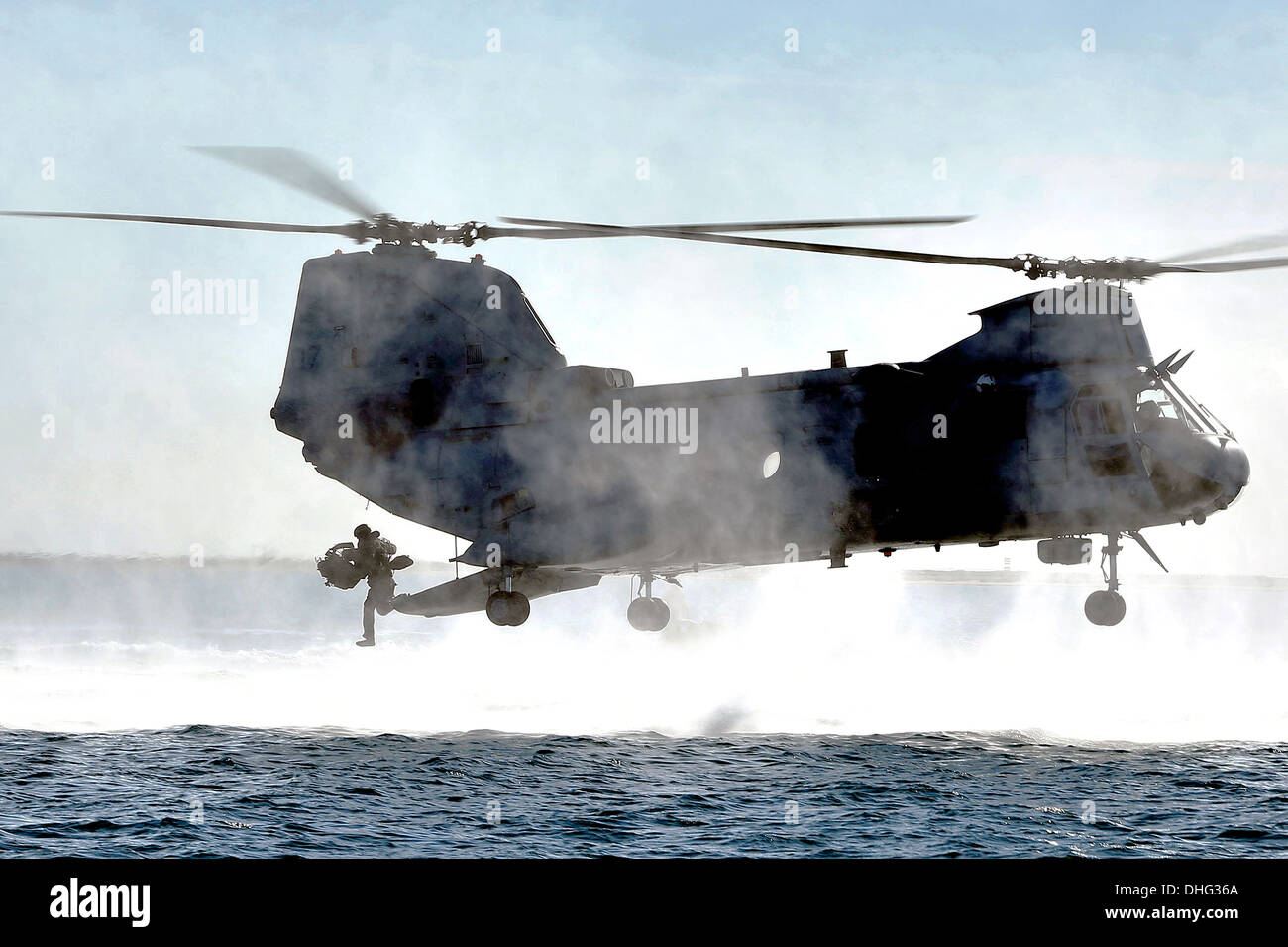 US Marines leap out the back of a Chinook helicopter during ...