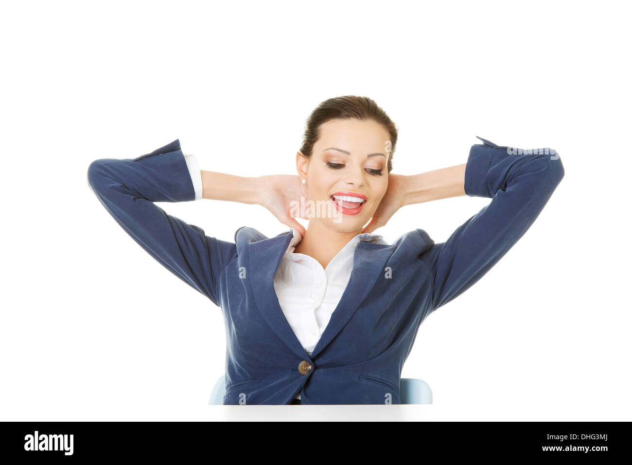Attractive woman sitting with her hands behind her neck. isolated onw ...