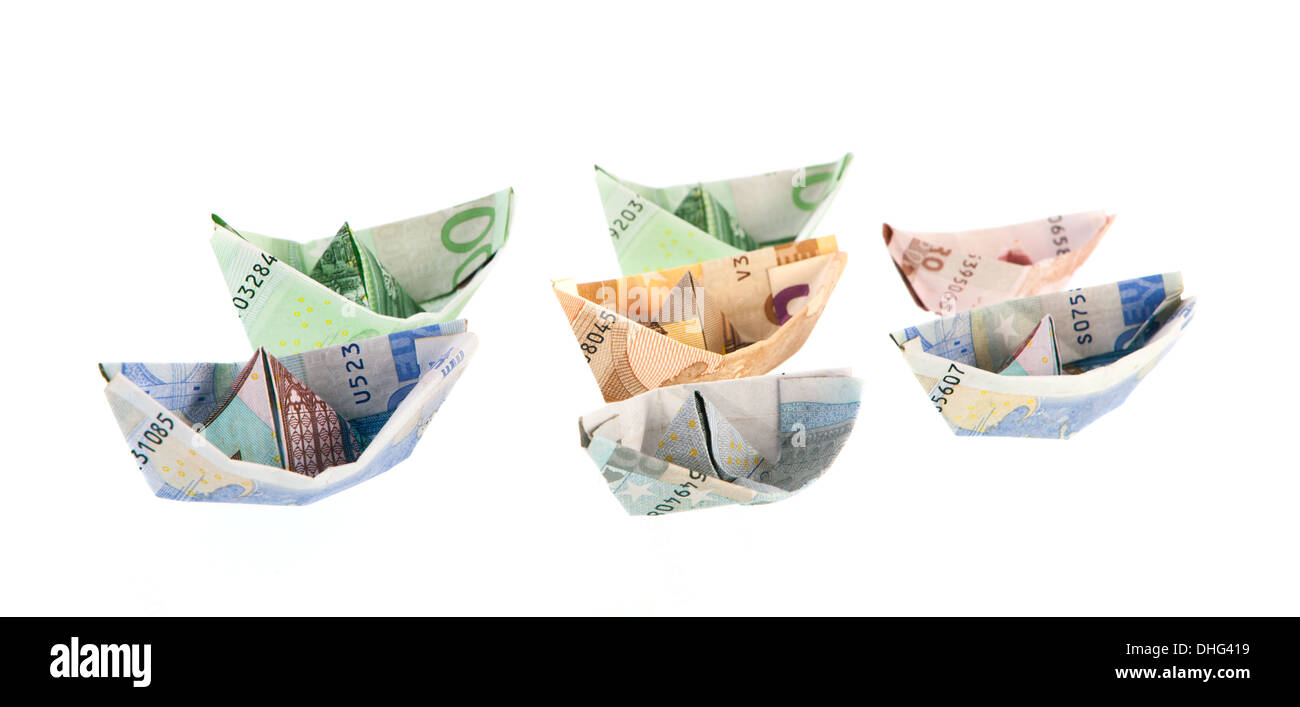 paper boats from euro money isolated over white background Stock Photo ...