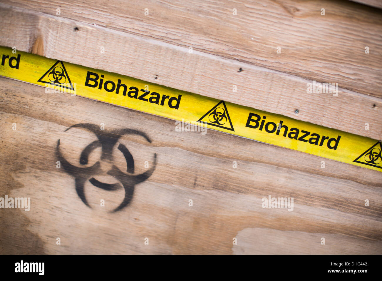 Large wooden box with biohazard tape and a quarantine painted stencil ...