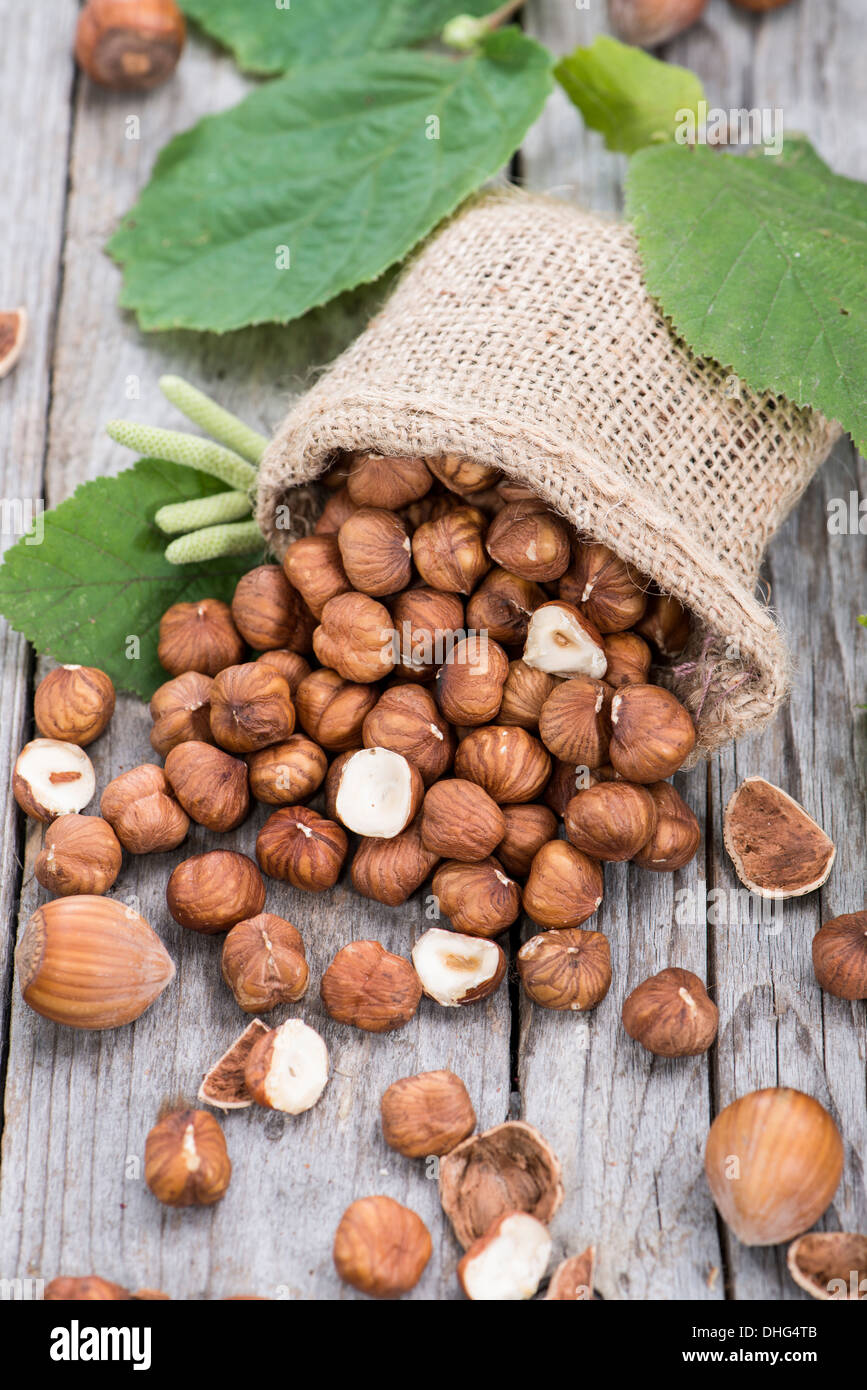 Heap of Hazelnuts on wooden background Stock Photo - Alamy