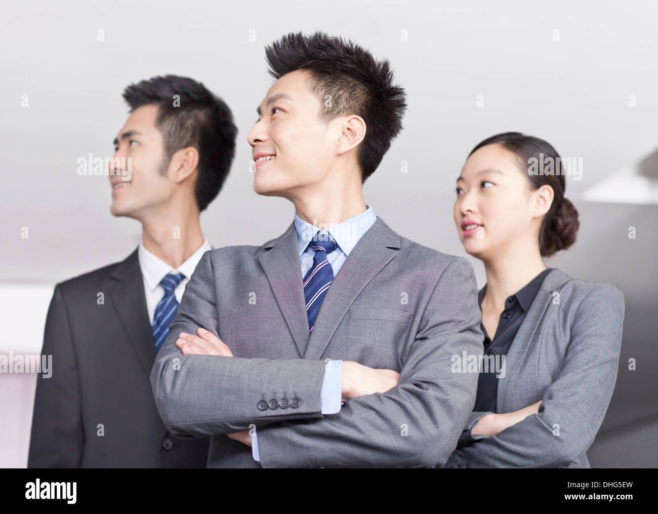 young office workers with hands crossed indoors,portrait Stock Photo ...