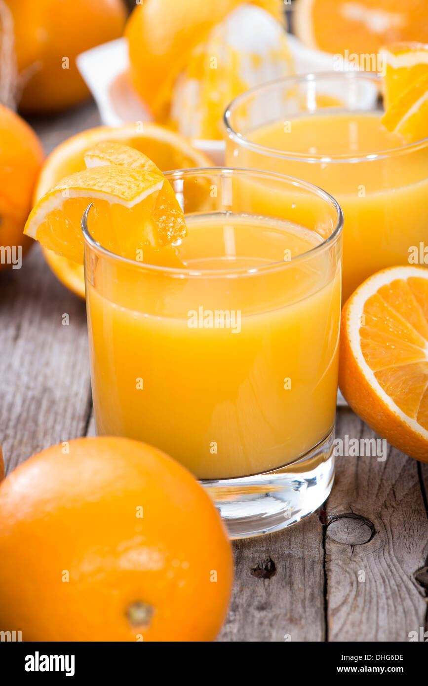 Fresh made Orange Juice on wooden background Stock Photo - Alamy