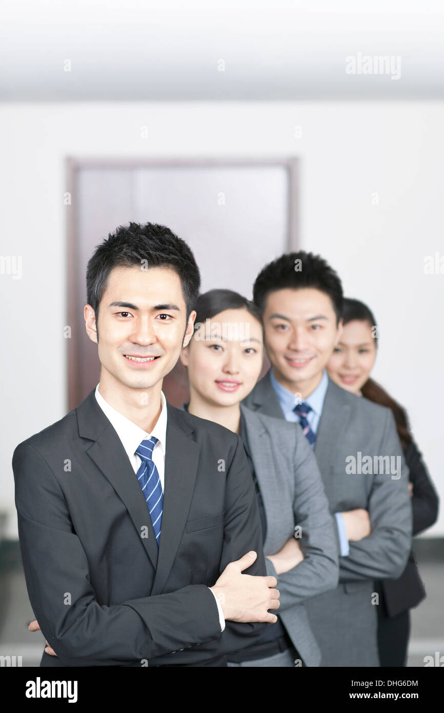 young office workers with hands crossed indoors,portrait Stock Photo ...