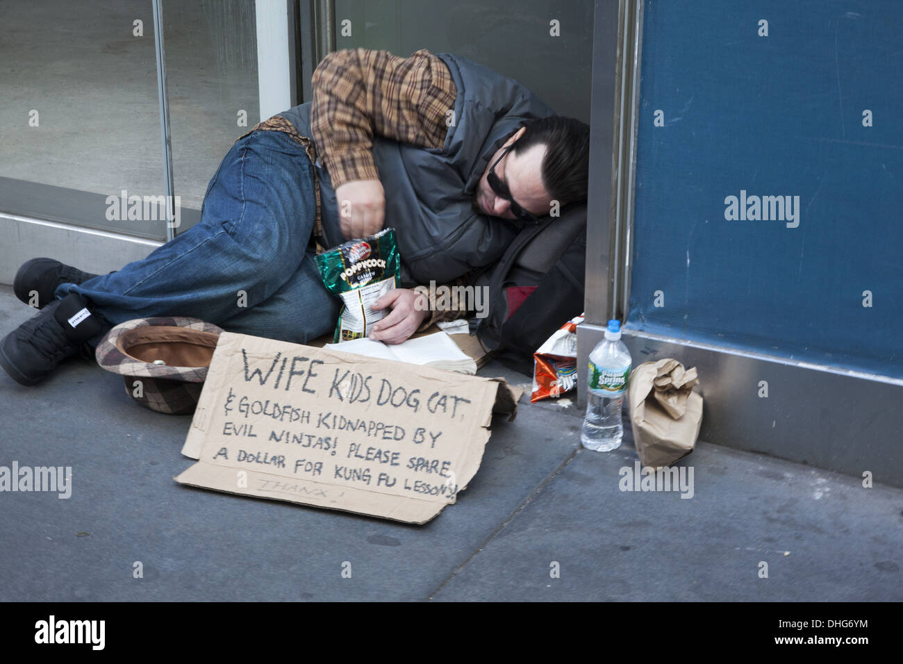Homeless man on street with sign hi-res stock photography and images ...