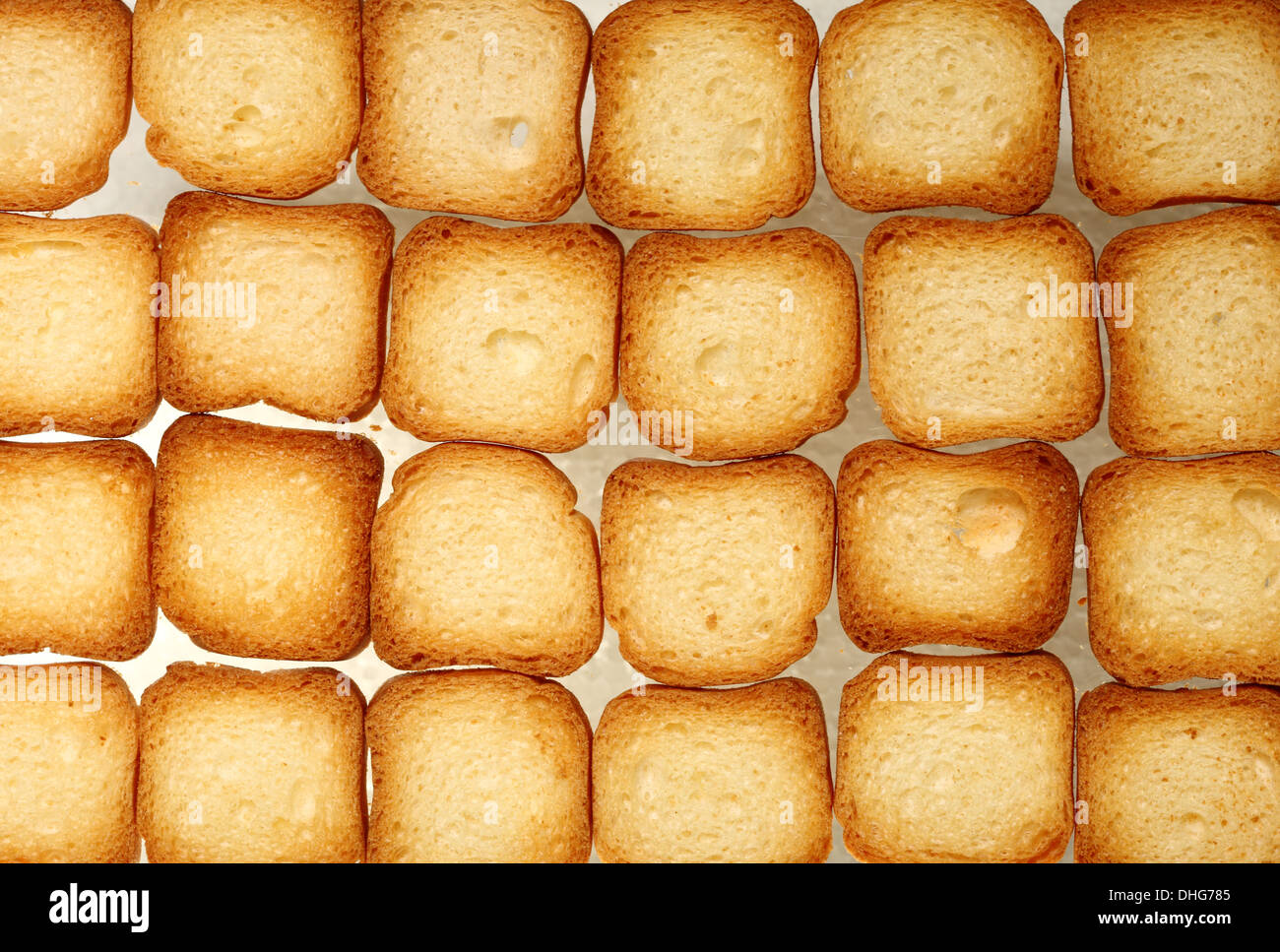 Many small dried rusks bread loaf toast biscuits as texture background ...