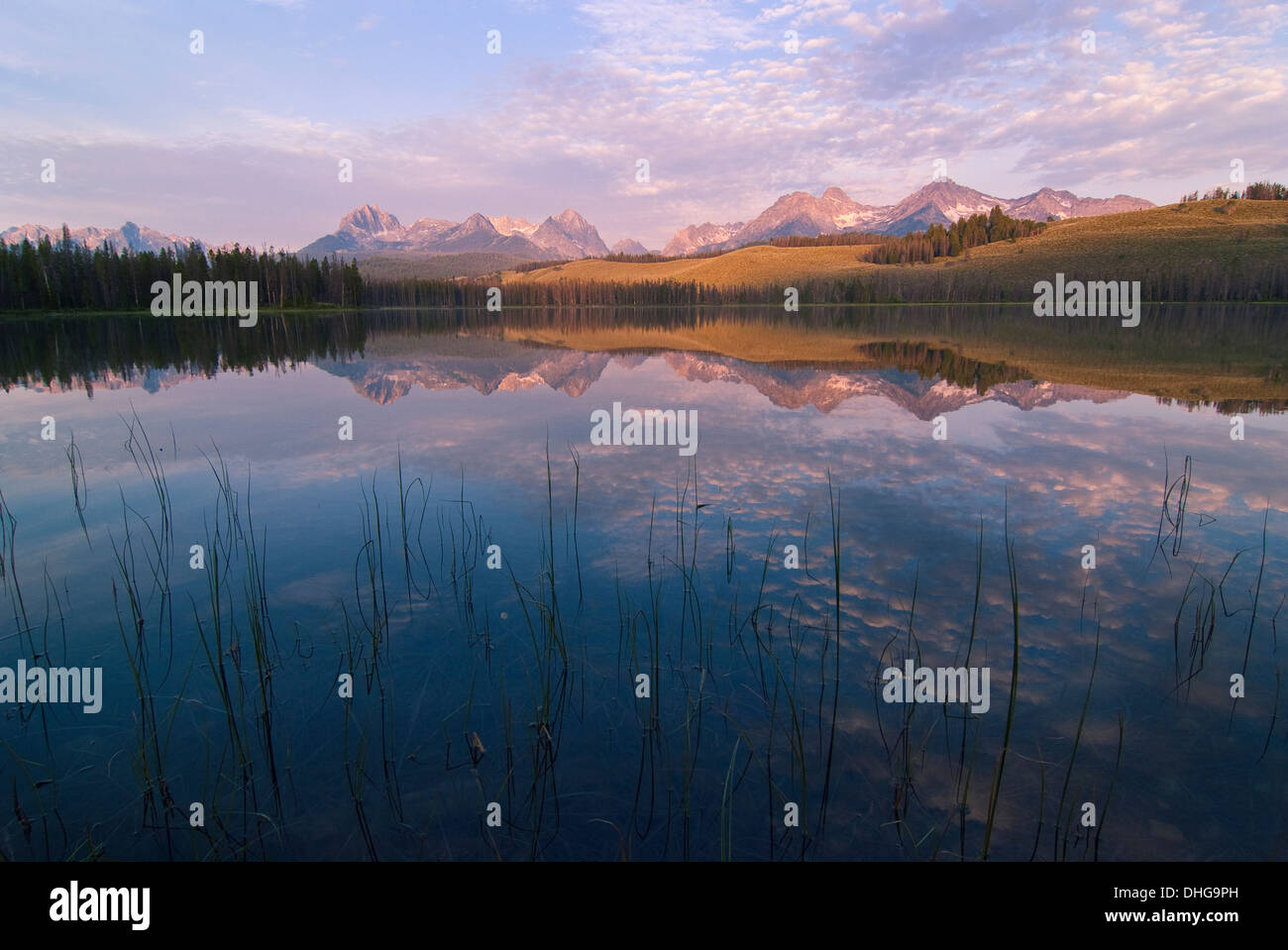 Sawtooth Mountains reflecting in Little Red Fish Lake, sunrise Stock ...