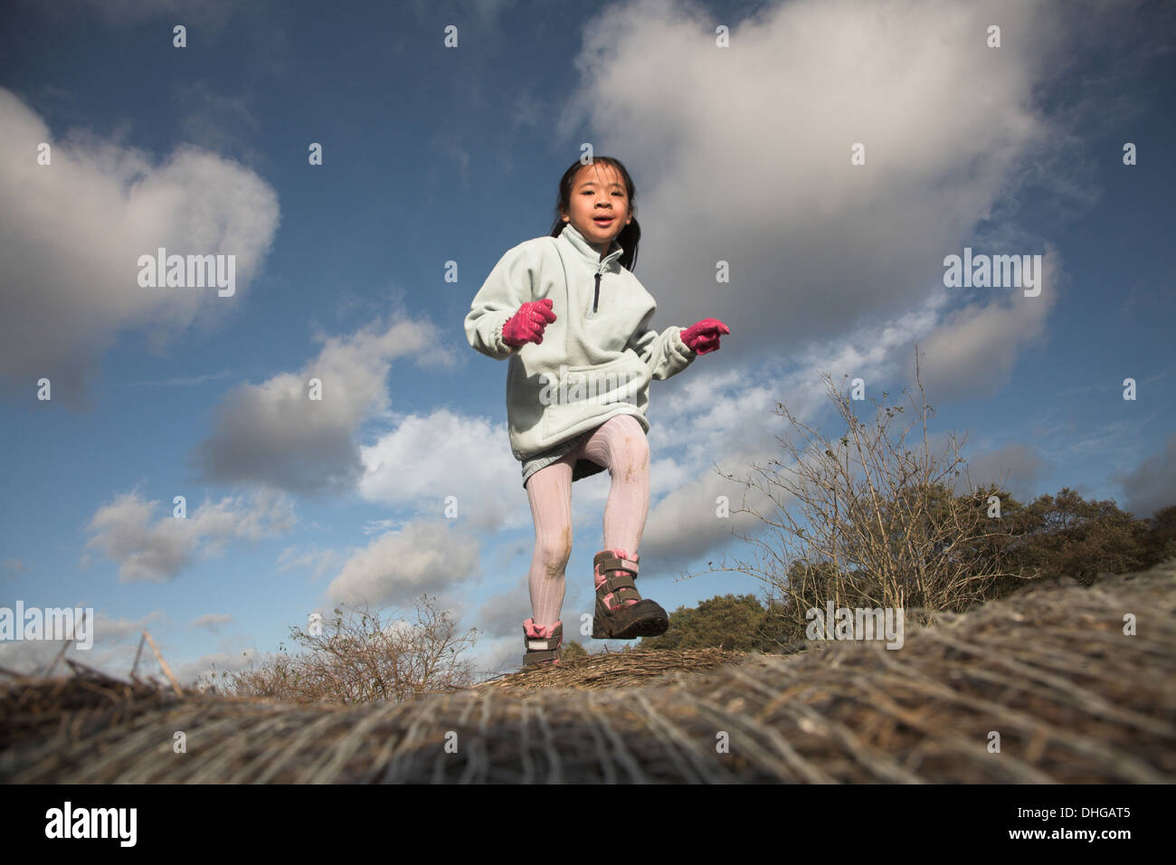 happy child outdoor jumping a summer day against a blue sky Stock Photo ...
