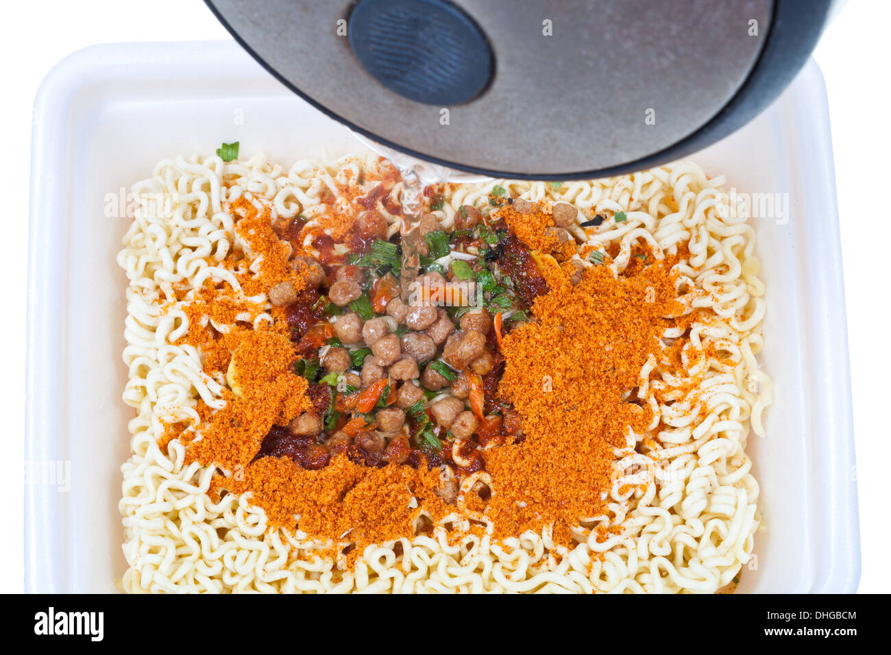 instant ramen pour boiling water from the kettle Stock Photo - Alamy