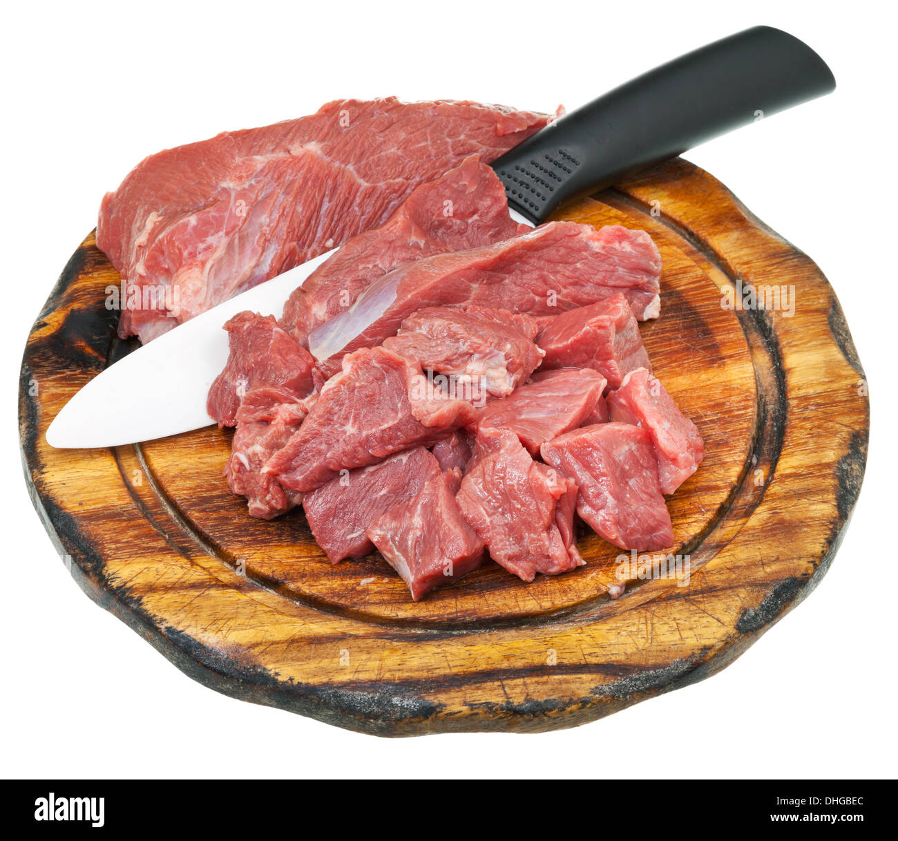 cut raw meat and ceramic knife on cutting wooden board isolated on ...