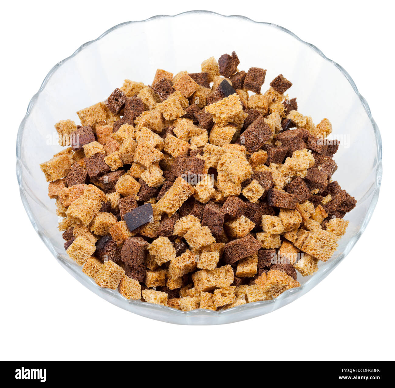 dried rye bread crust pieces in glass bowl isolated on white background ...