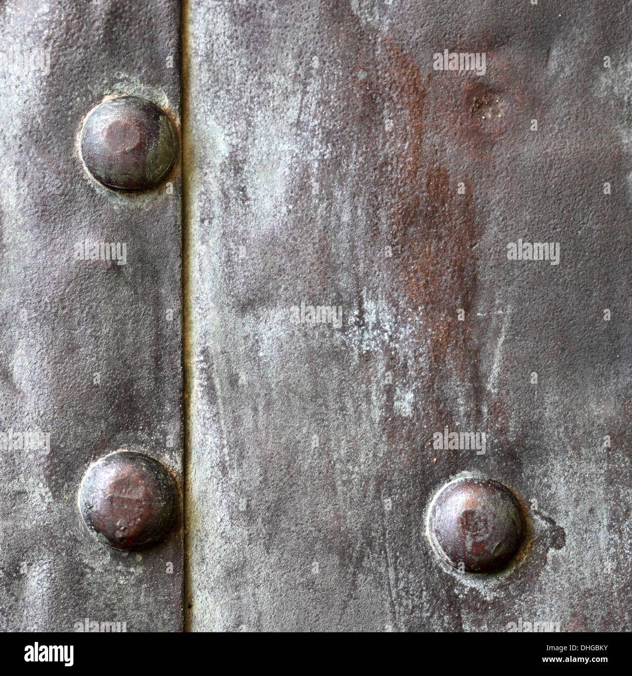 Black grunge metal plate or armour texture with rivets as background ...