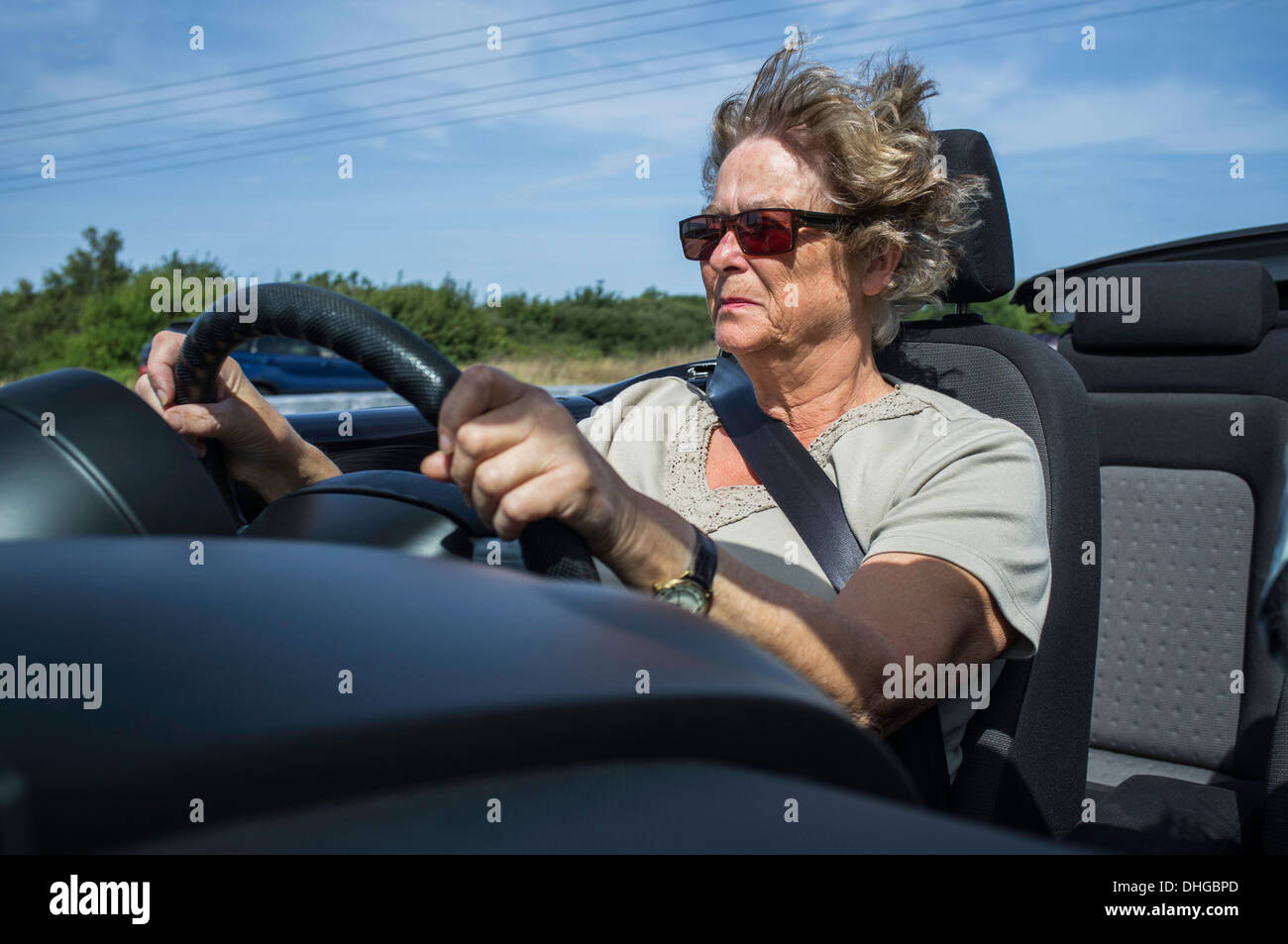 Mature lady driving car hi-res stock photography and images - Alamy