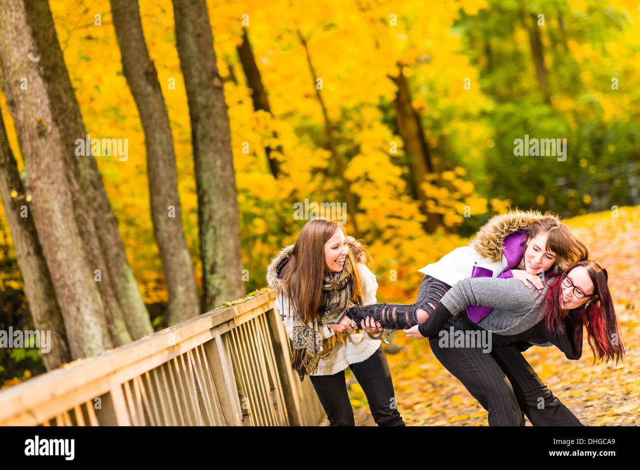 Three sisters play pranks on bridge and they have a fun together on ...
