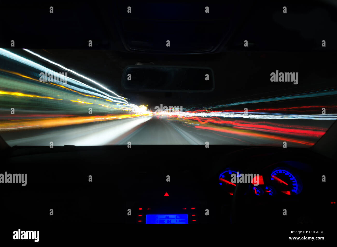 view through the windscreen of a moving car with motion blur and ...