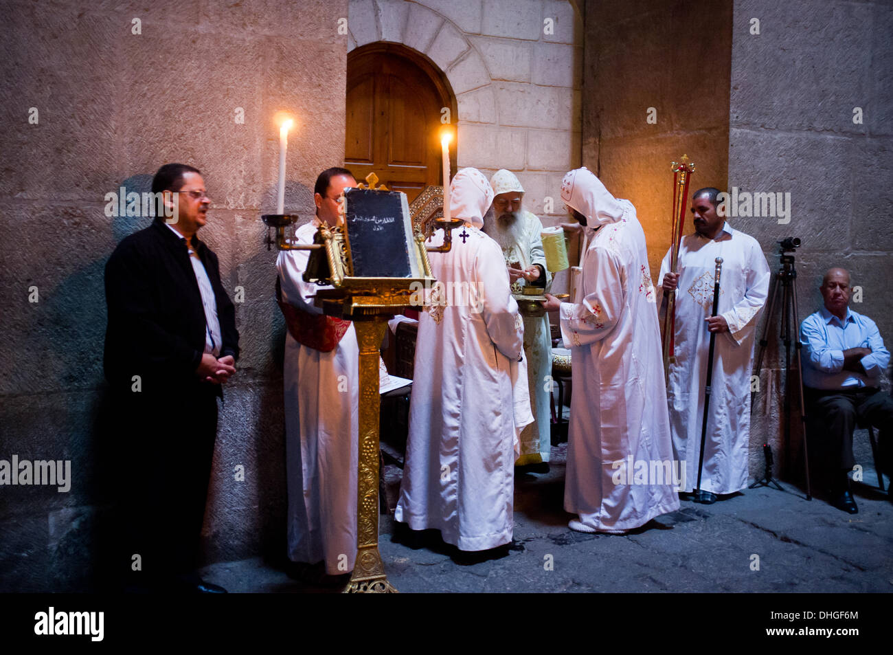 Coptic priests assist each other in washing their hands during Sunday ...