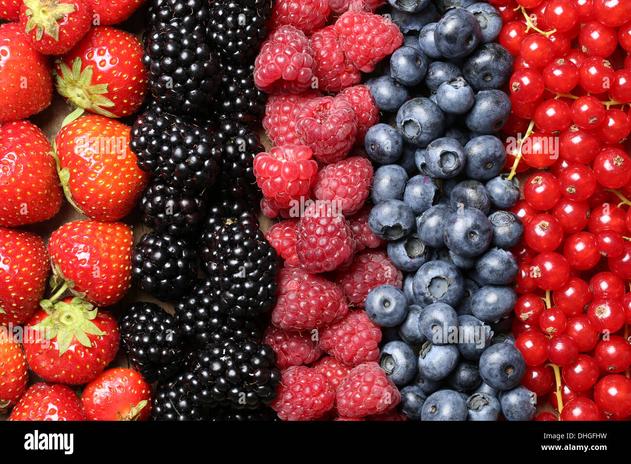 Berry fruits like strawberries, blueberries, red currants, raspberries ...