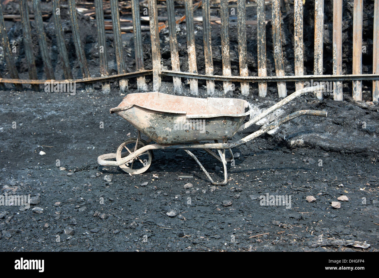 Charred burnt wheelbarrow after factory fire Stock Photo - Alamy