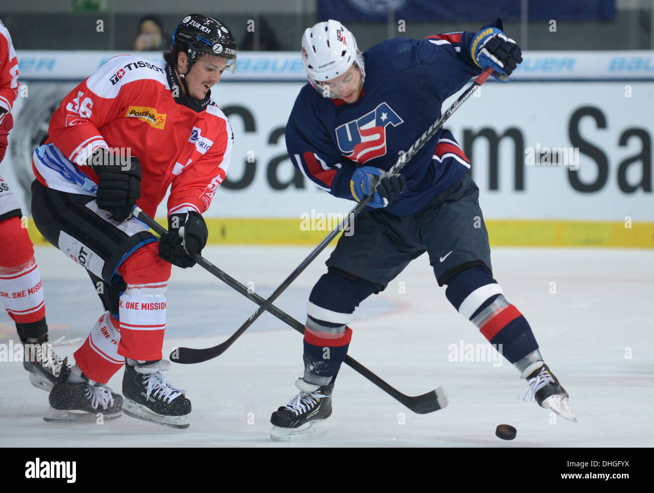 Munich, Germany. 9th Nov, 2013. Swiss' Dino Wieser (L) and USA's Derek ...