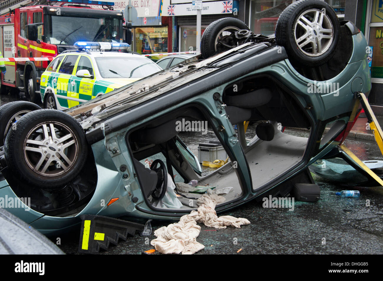 Car Crash overturned on roof rescue Stock Photo - Alamy