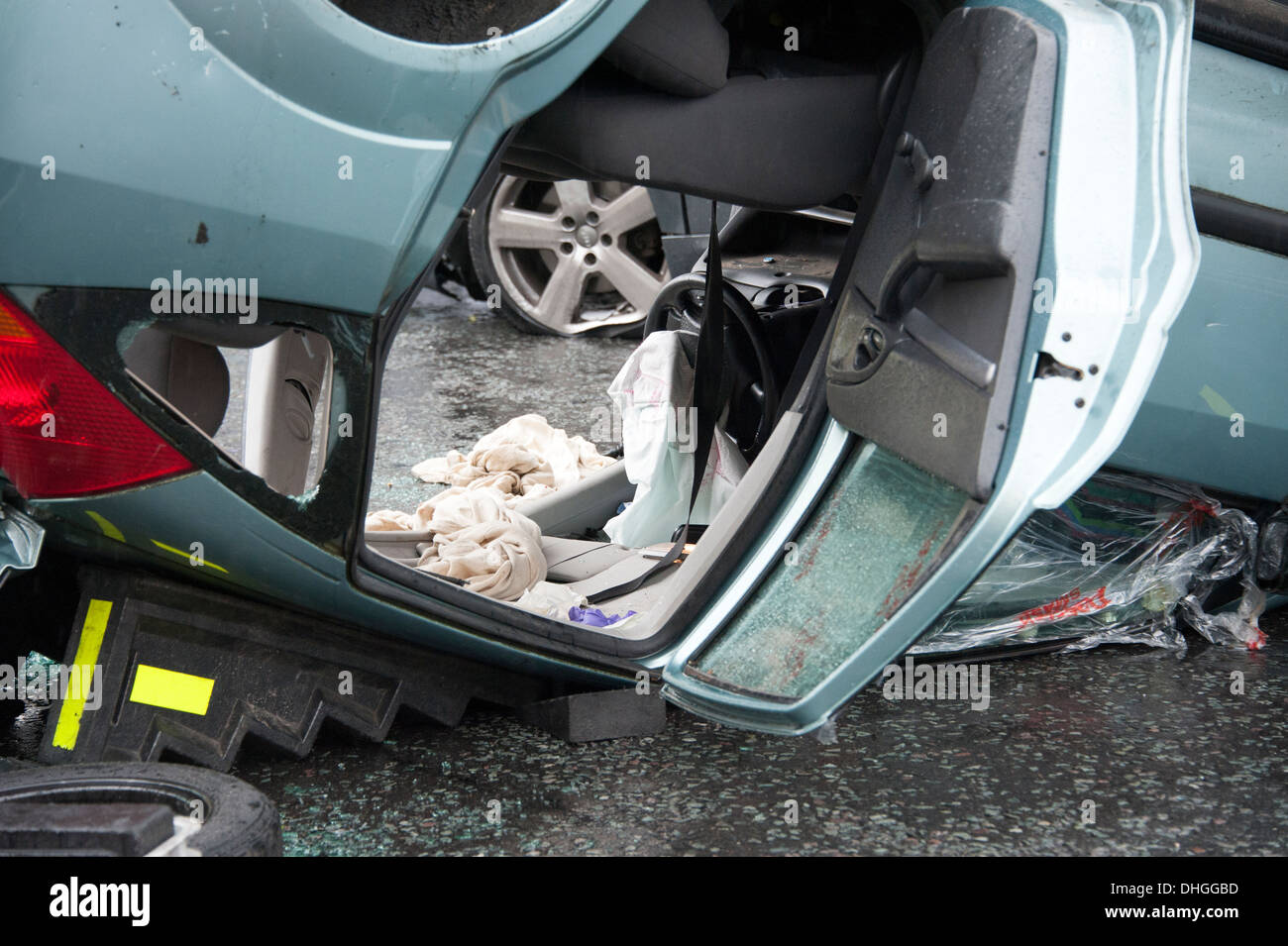 Car Crash overturned on roof rescue Stock Photo - Alamy