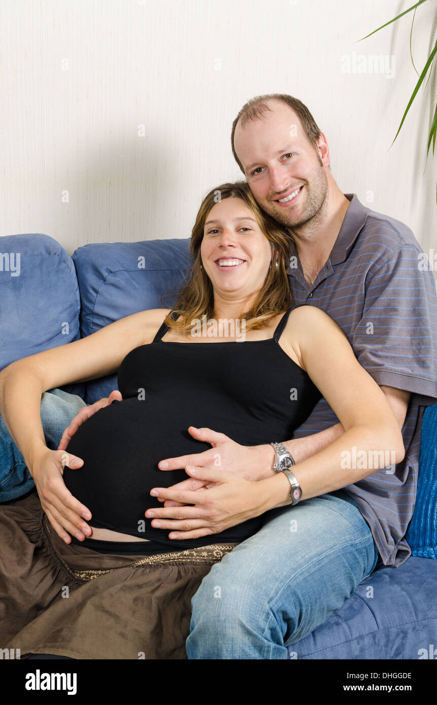 Pregnant woman sitting on couch hi-res stock photography and images - Alamy