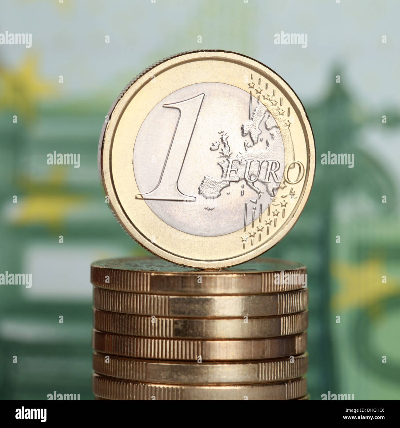 One Euro coin on a stack of many Euro coins Stock Photo - Alamy