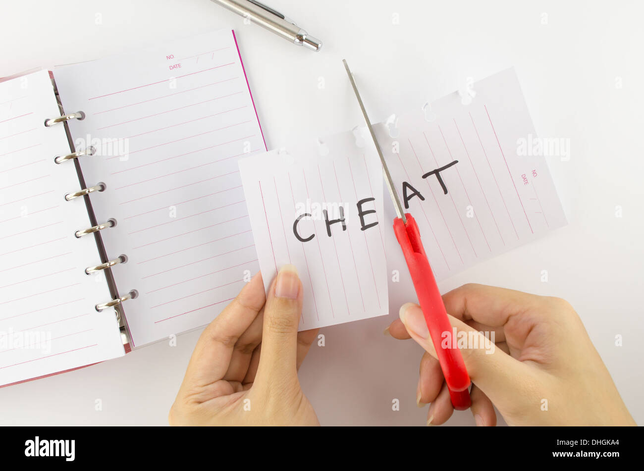 Persons who were cutting paper labeled "cheat Stock Photo - Alamy