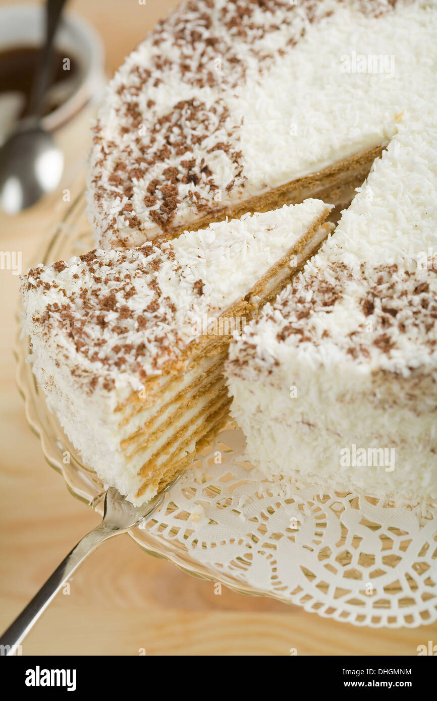 Triangle cut piece of coconut cake Stock Photo - Alamy
